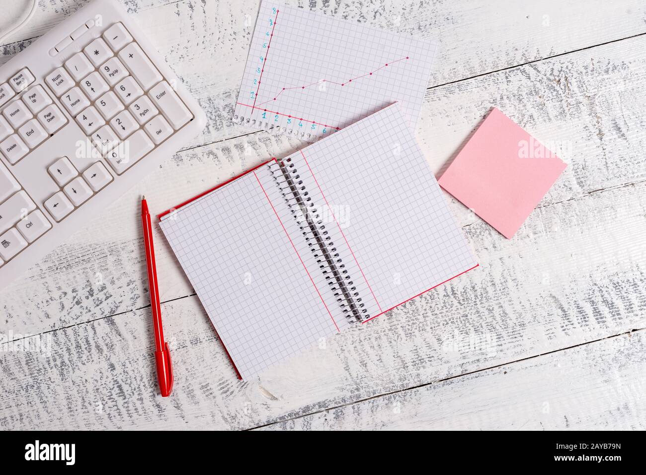 White old wooden desk with office appliances, computer equipments and a ...