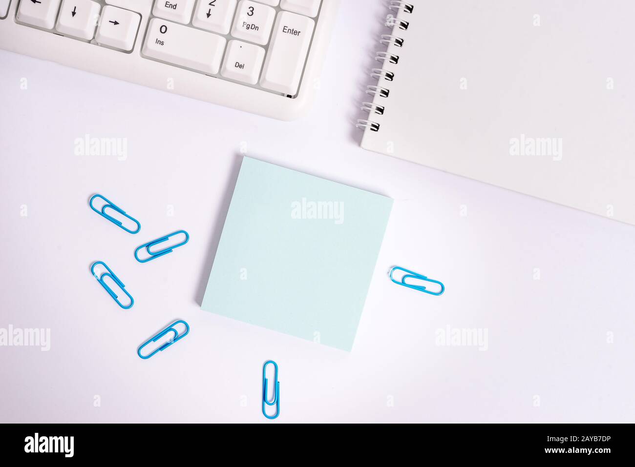 Flat lay above blank paper for text messages. Empty note paper on the ...