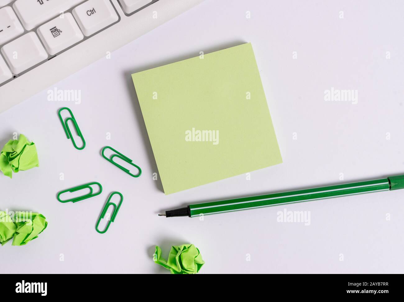 Flat lay above blank note paper for text messages. Square empty green ...