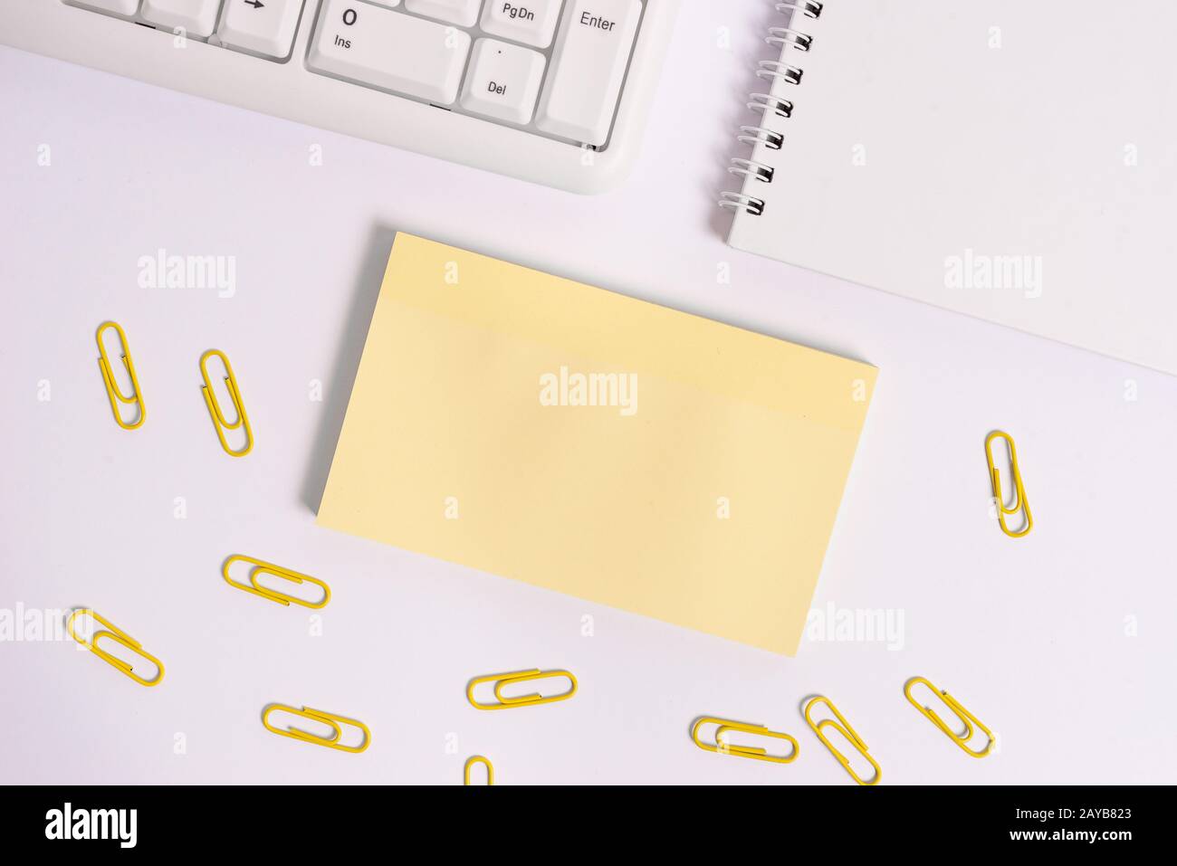 Flat lay above blank paper for text messages. Empty note paper on the ...