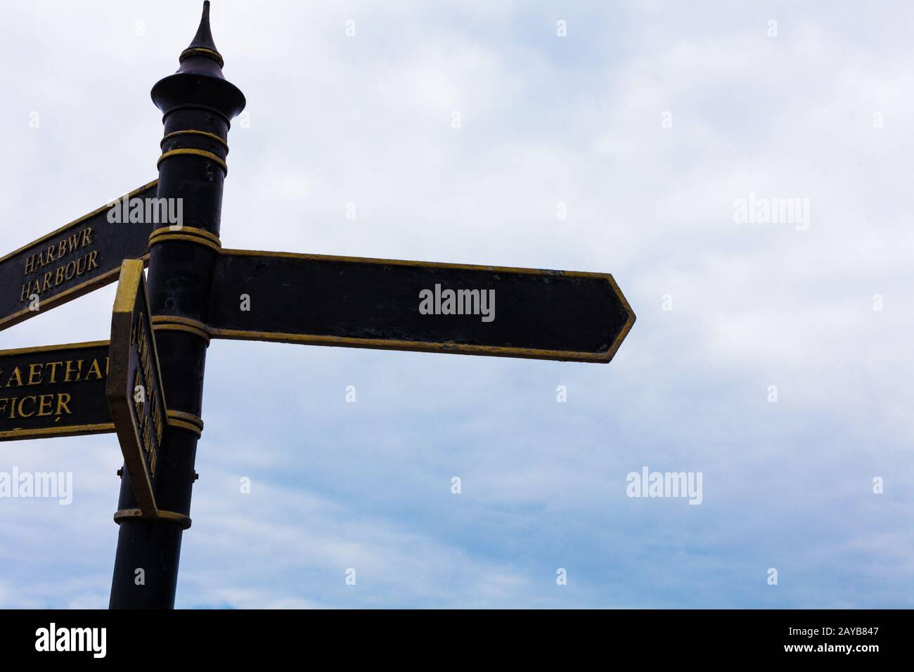 Traveling concept with crossroad sign and blue background. Road sign on ...