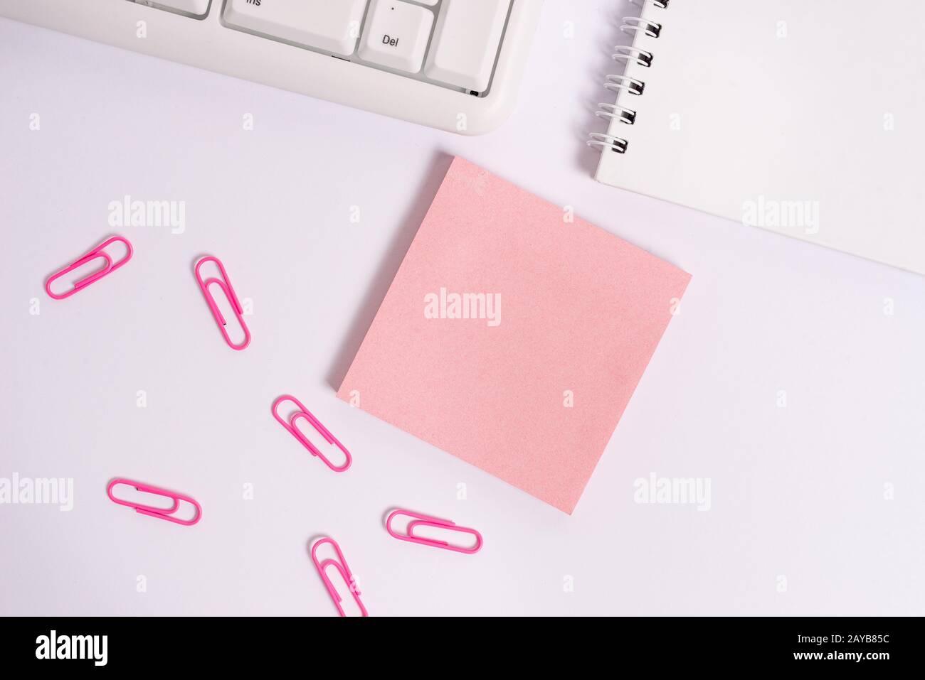 Empty note paper on the white background by the pc keyboard with copy ...