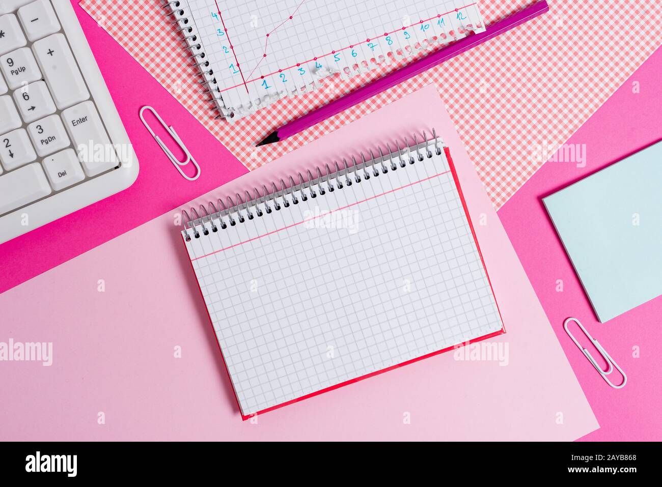 Writing equipments and computer stuffs plus mathematic paper placed on ...