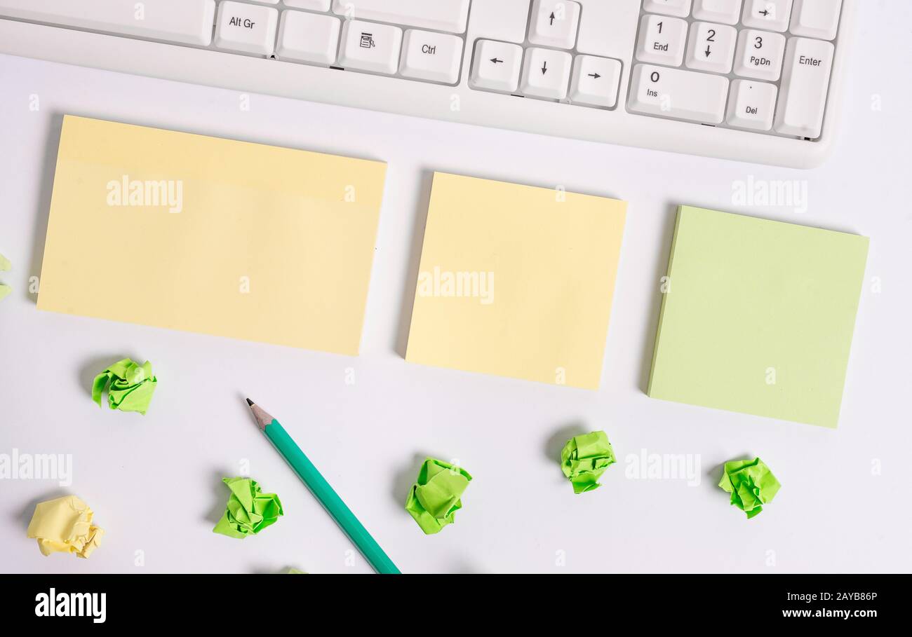 Blank papers for text messages. Sticky note paper on the table with pc ...