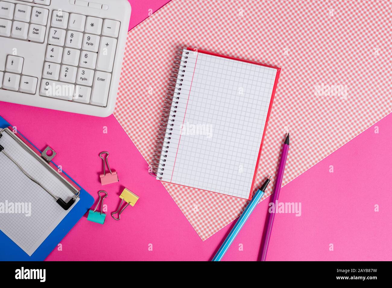 Writing equipments and computer stuffs plus mathematic paper placed on ...