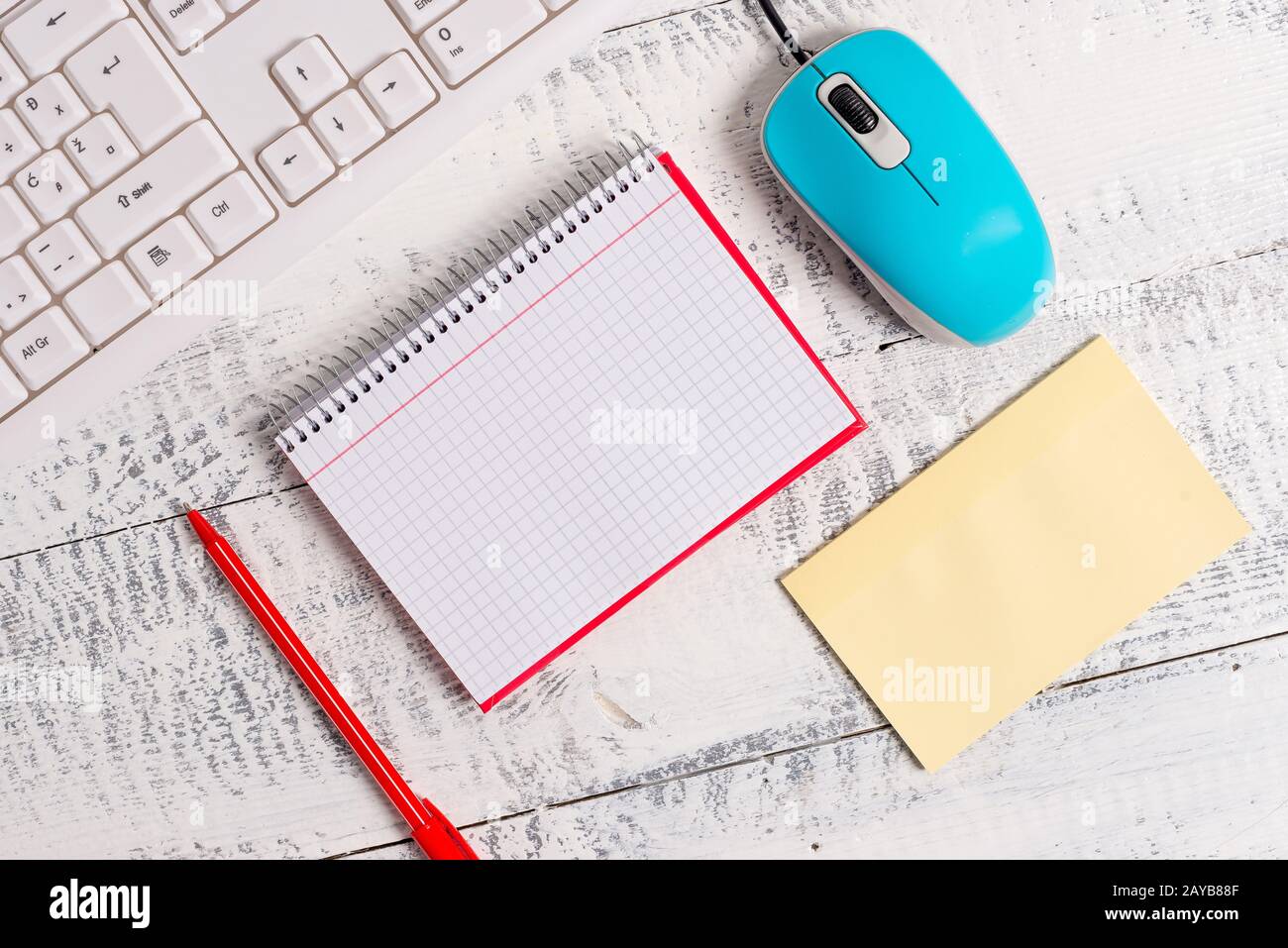 Writing equipments and computer tools plus mathematic paper placed on a ...