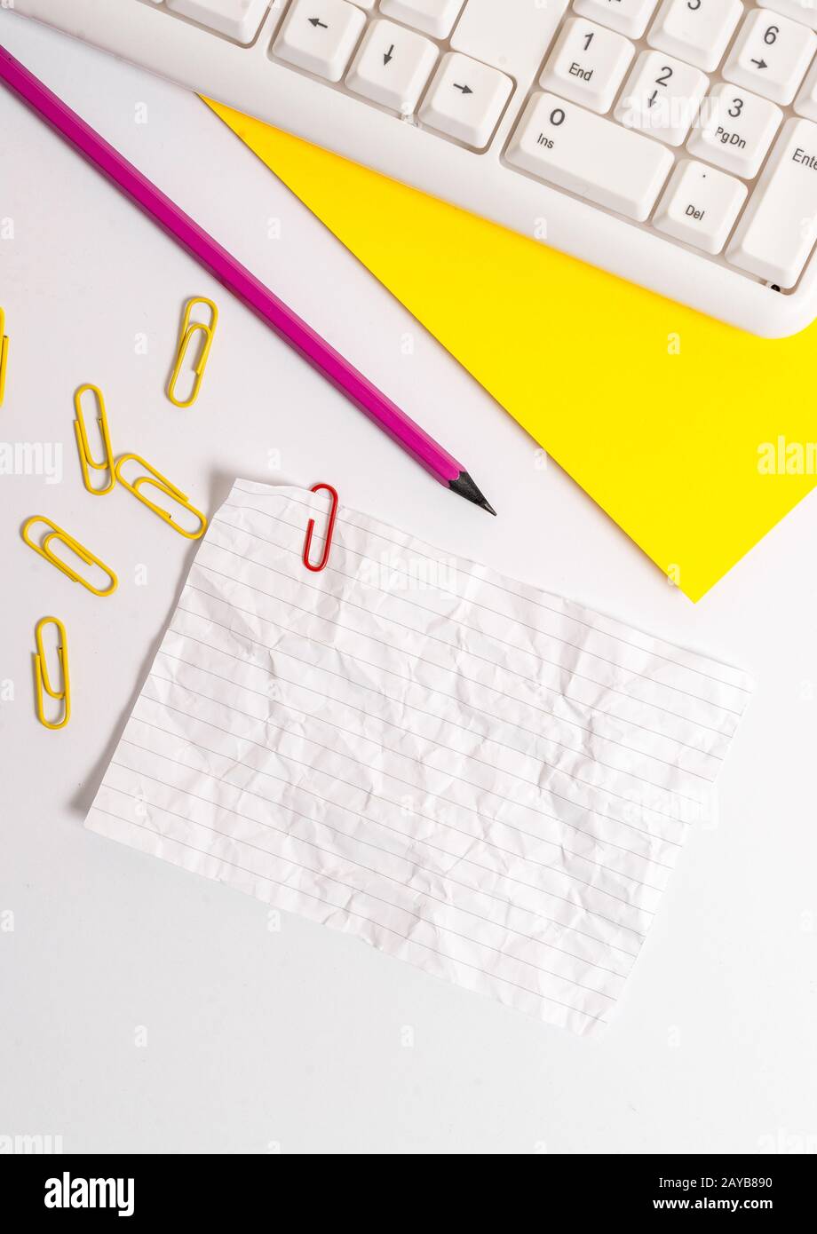 Pc keybord on the table with empty white paper. Flat lay above white ...