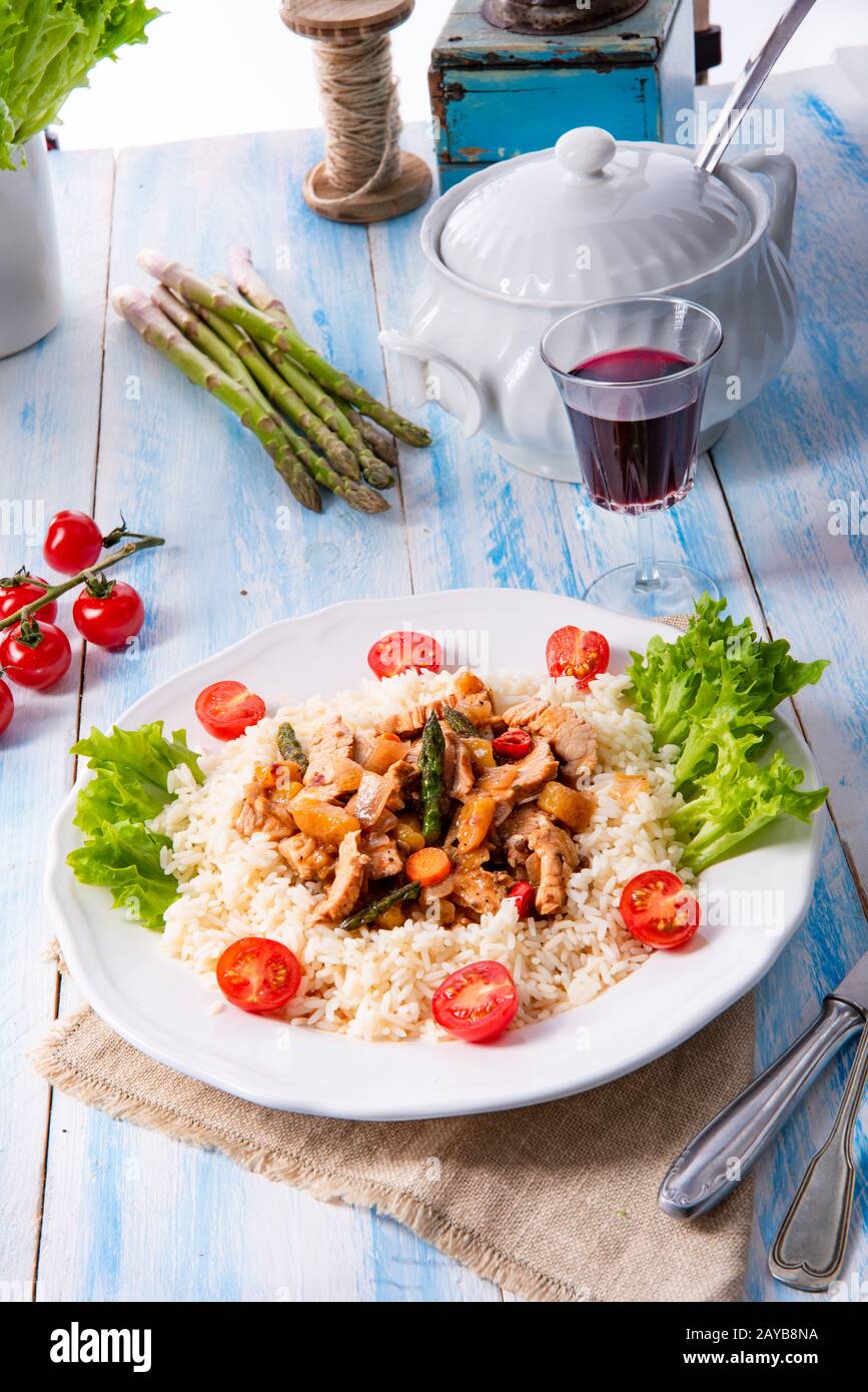 Turkey fricassee on rice with asparagus and paprika Stock Photo - Alamy