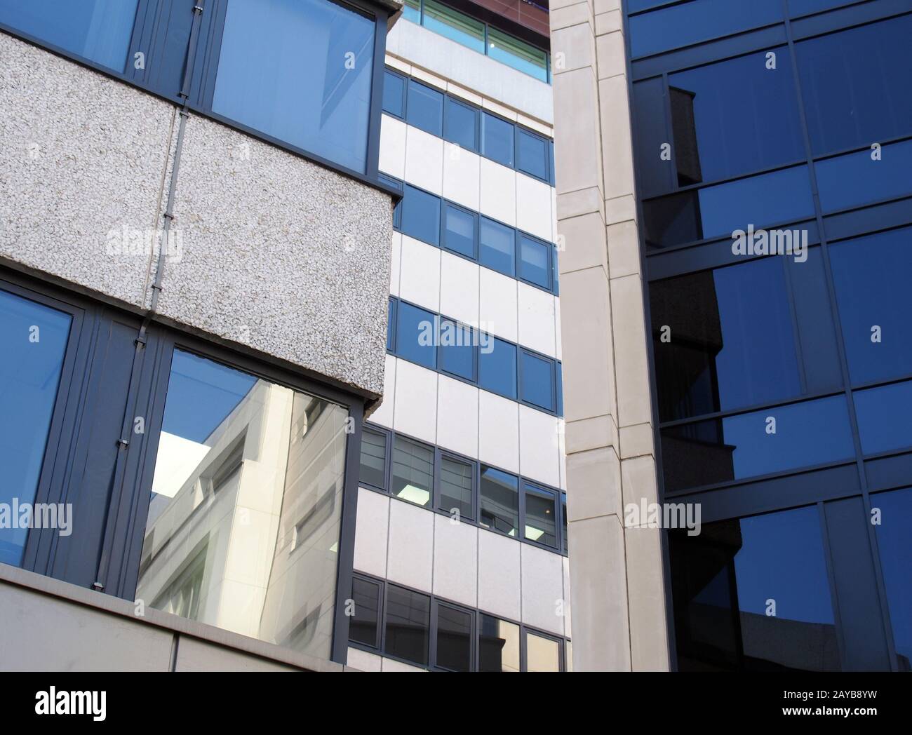 windows and reflections in the windows of a group of large modern ...