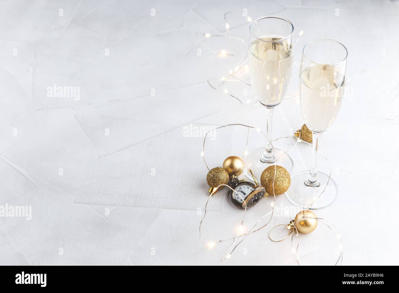 Pocket watch and champagne glasses Stock Photo - Alamy