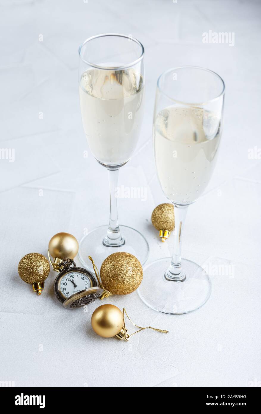 Pocket watch and champagne glasses Stock Photo - Alamy