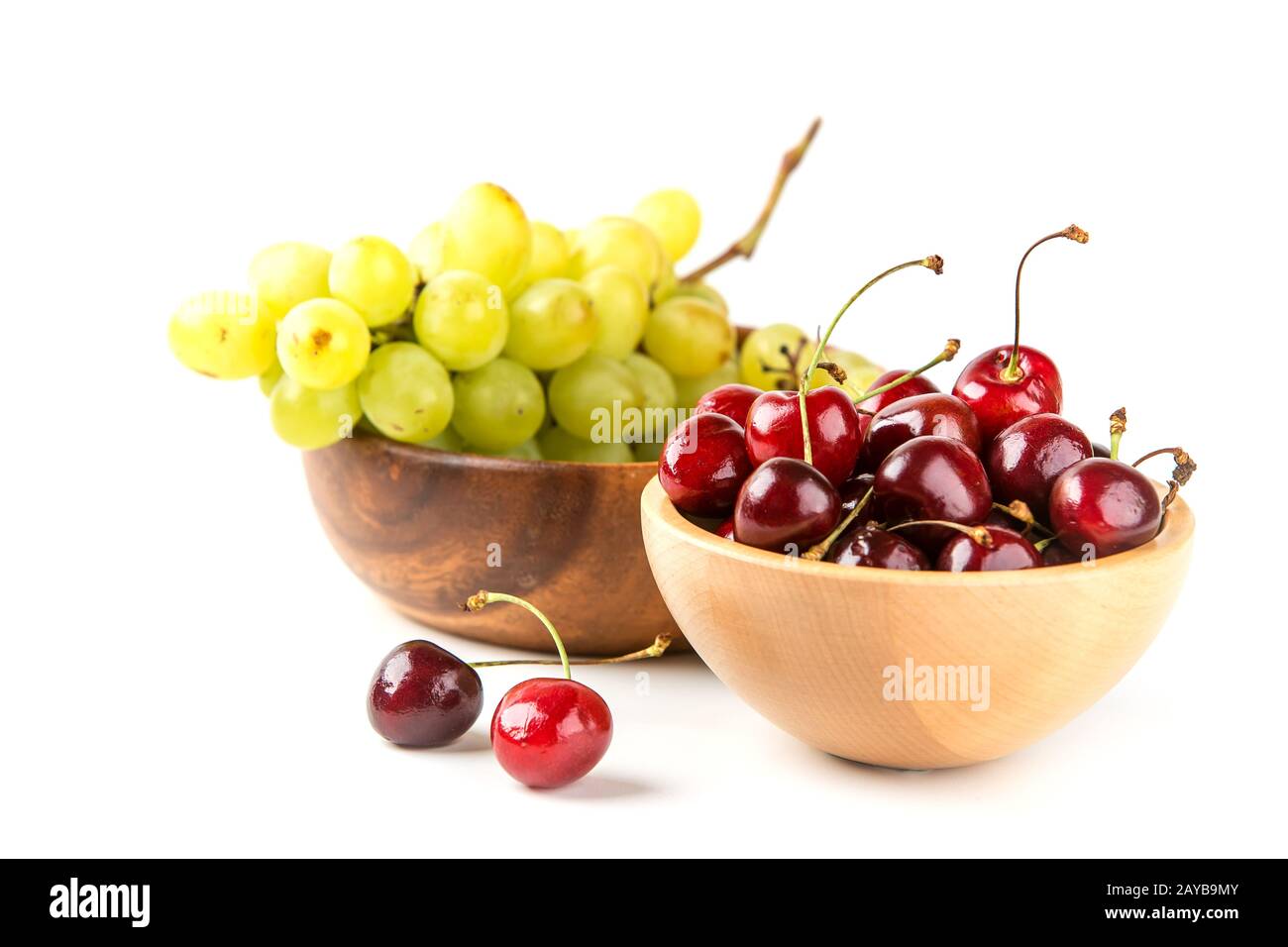 Grapes and cherry in the bowls Stock Photo - Alamy