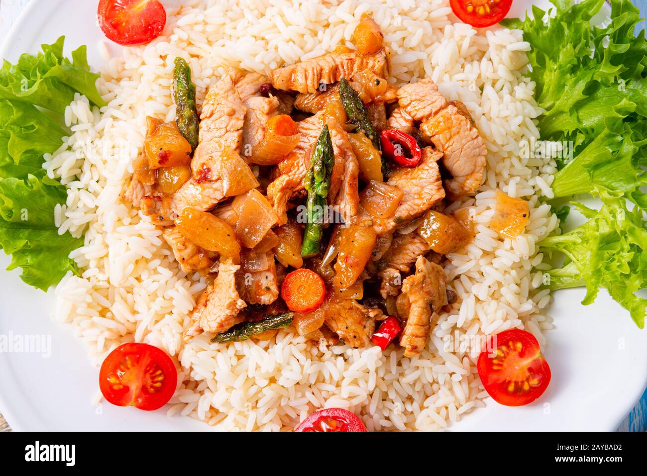 Turkey fricassee on rice with asparagus and paprika Stock Photo - Alamy