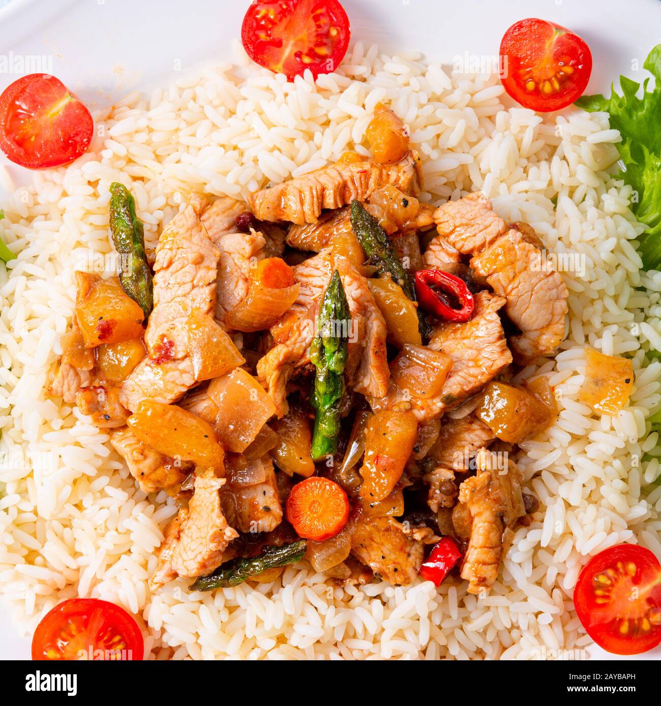 Turkey fricassee on rice with asparagus and paprika Stock Photo - Alamy