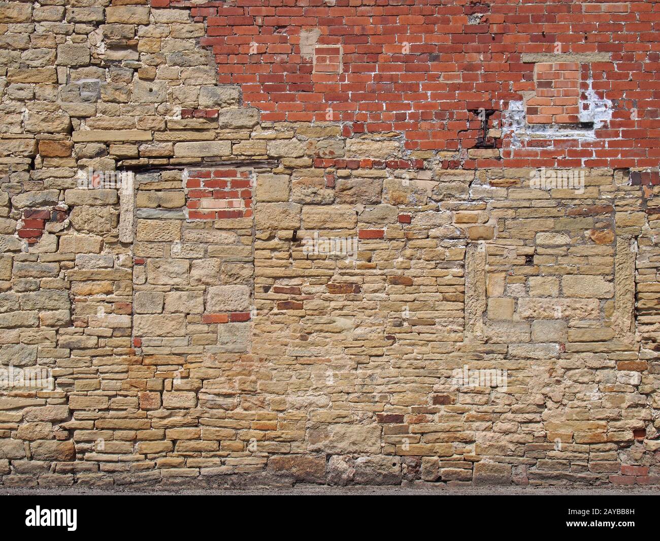 Wall of stone patched with brick hi-res stock photography and images ...