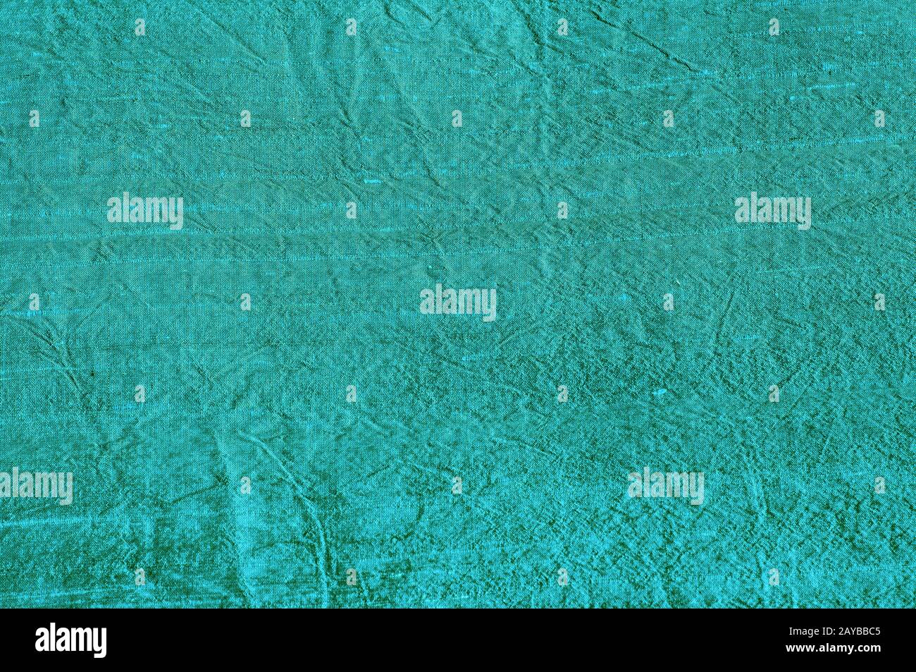Texture of turquoise shantung silk fabric closeup as textile background ...