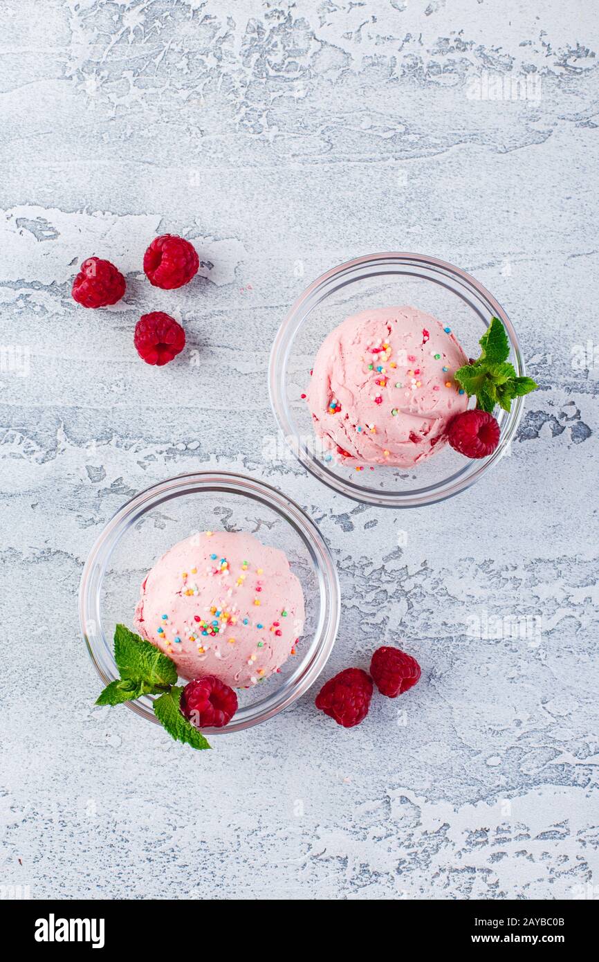 Raspberry ice cream in bowl Stock Photo - Alamy