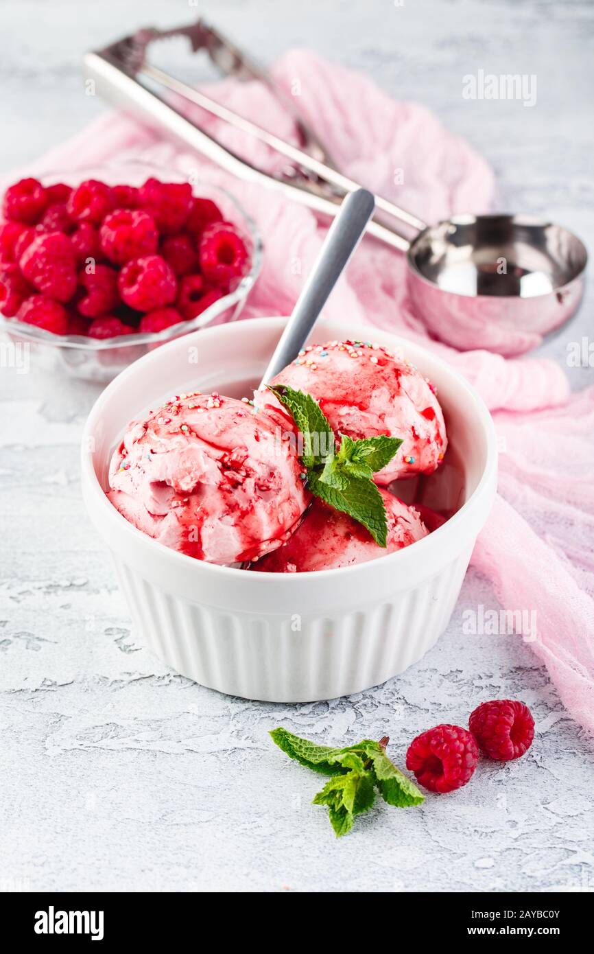 Raspberry ice cream in bowl Stock Photo - Alamy