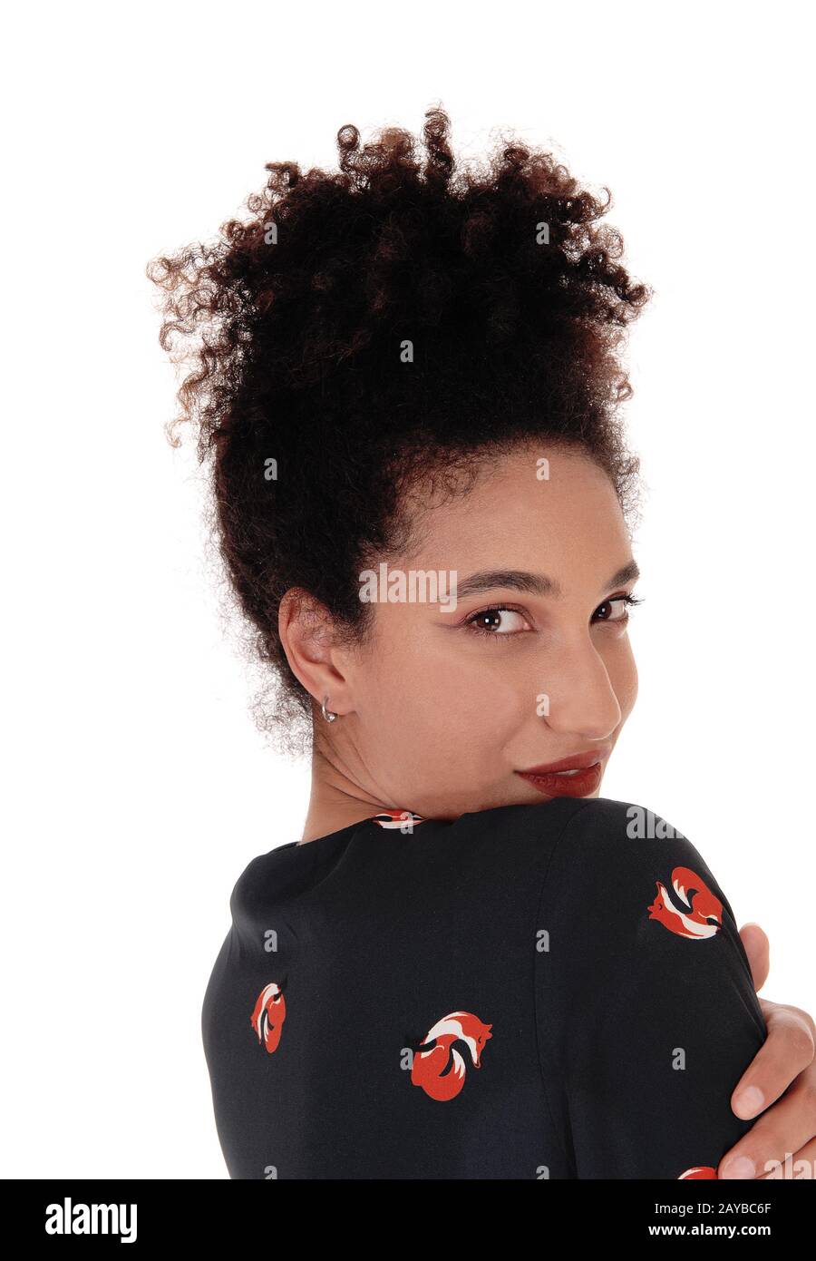 Beautiful multi-racial woman looking over her shoulder Stock Photo - Alamy