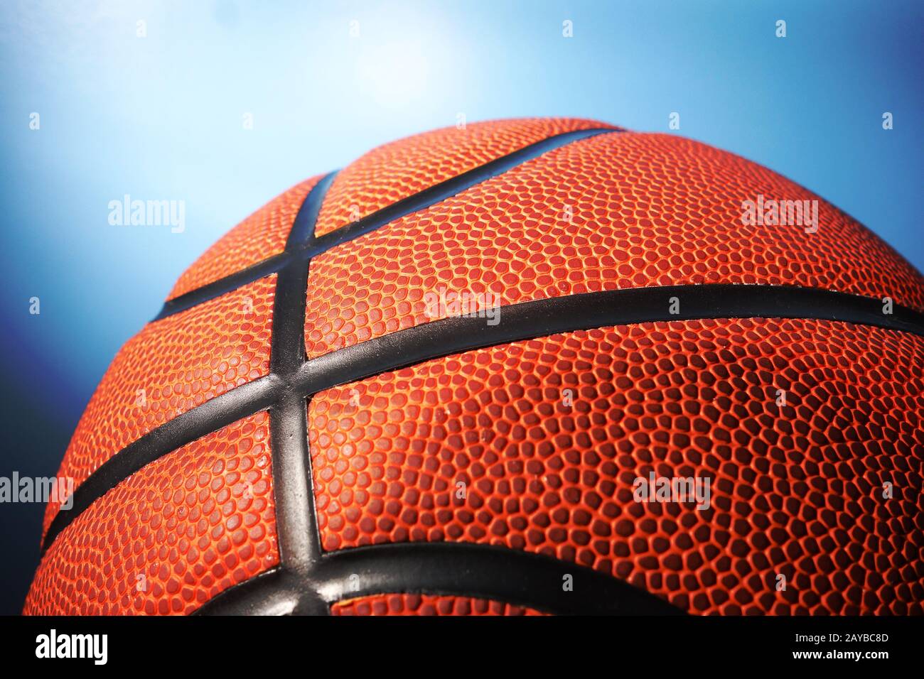 Basketball on blue Stock Photo - Alamy
