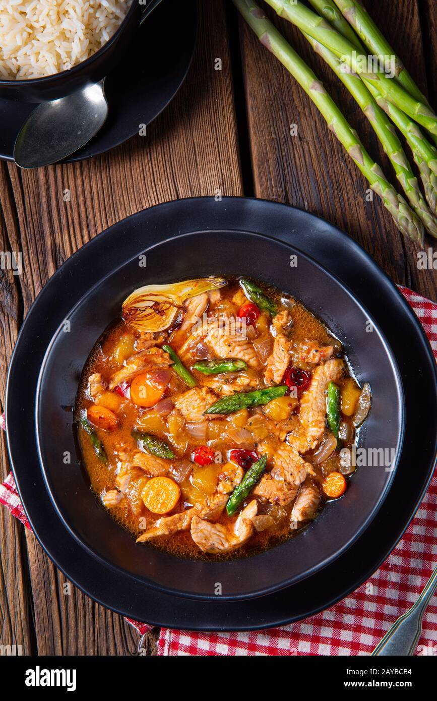 colorful turkey fricassee with asparagus and paprika Stock Photo - Alamy