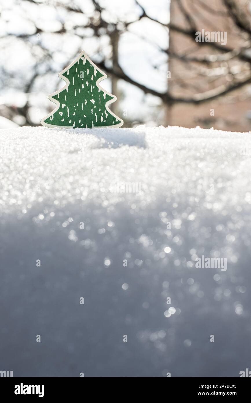 Wooden christmas tree on snow Stock Photo - Alamy