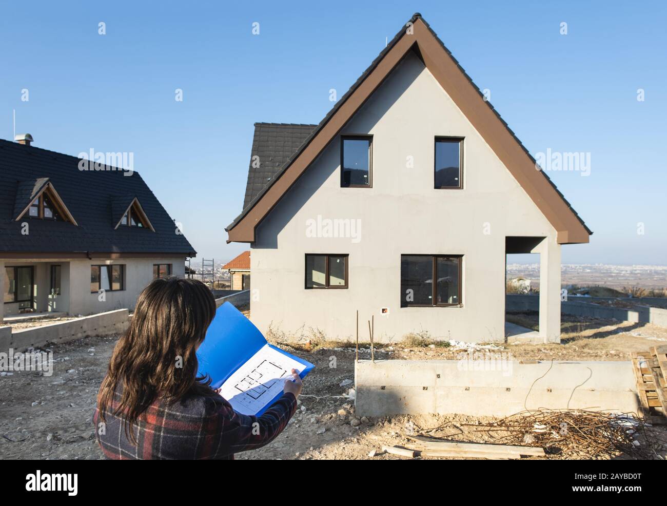 New build house and blueprints Stock Photo - Alamy
