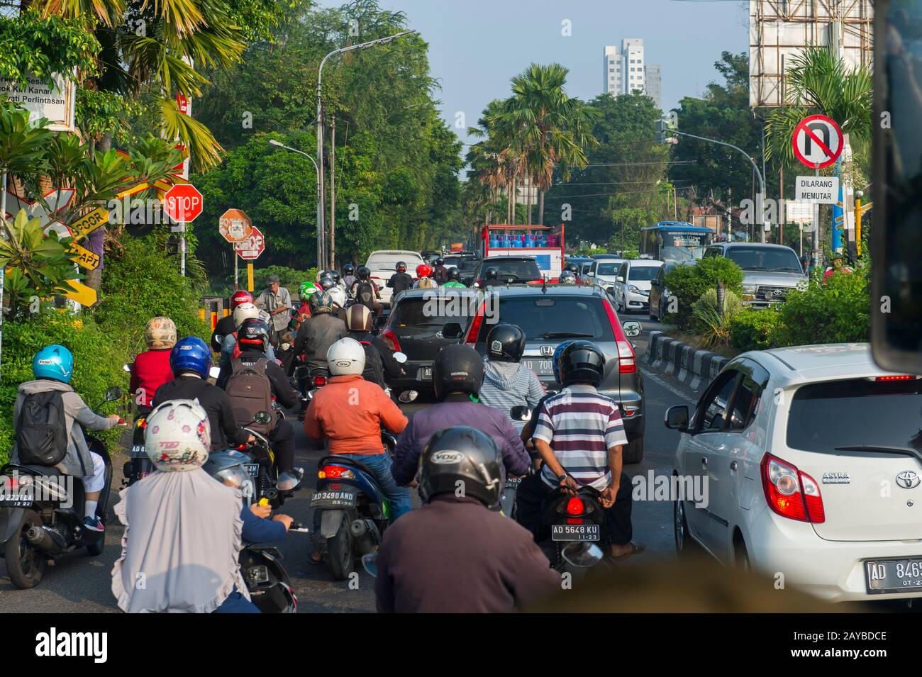 Street scene with cars and mopeds in Solo, a city on Java, Indonesia ...