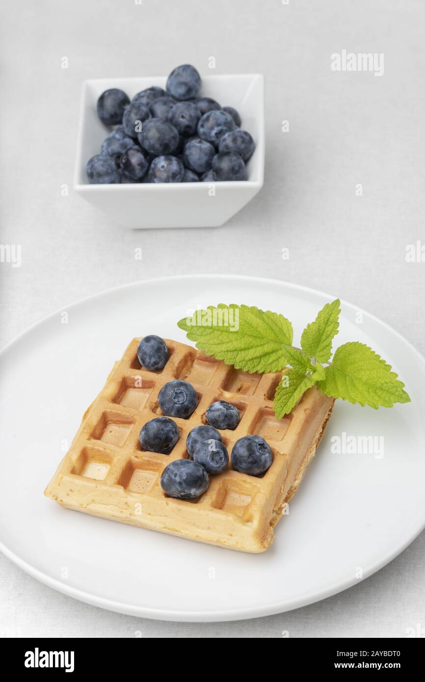 Belgian waffle with blueberries Stock Photo - Alamy