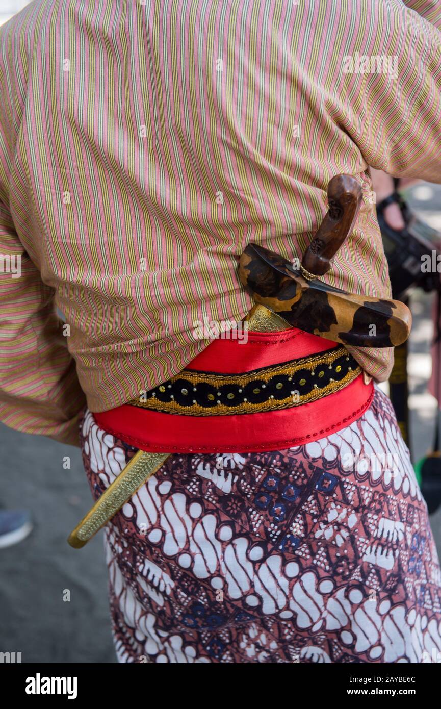 A man with a traditional Kris (sword) at the Kraton of Yogyakarta ...