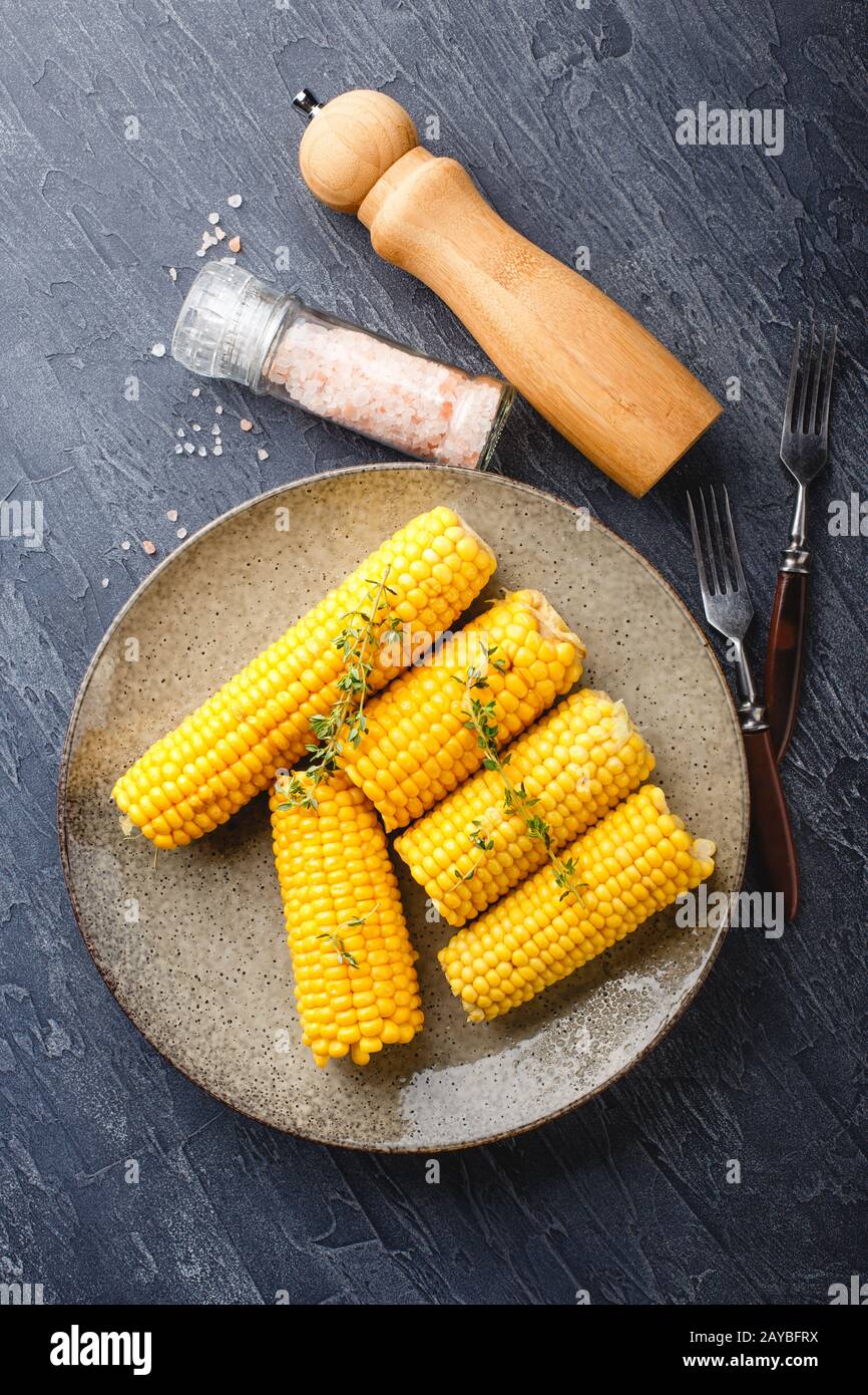 Tasty boiled corn cobs on plate Stock Photo - Alamy