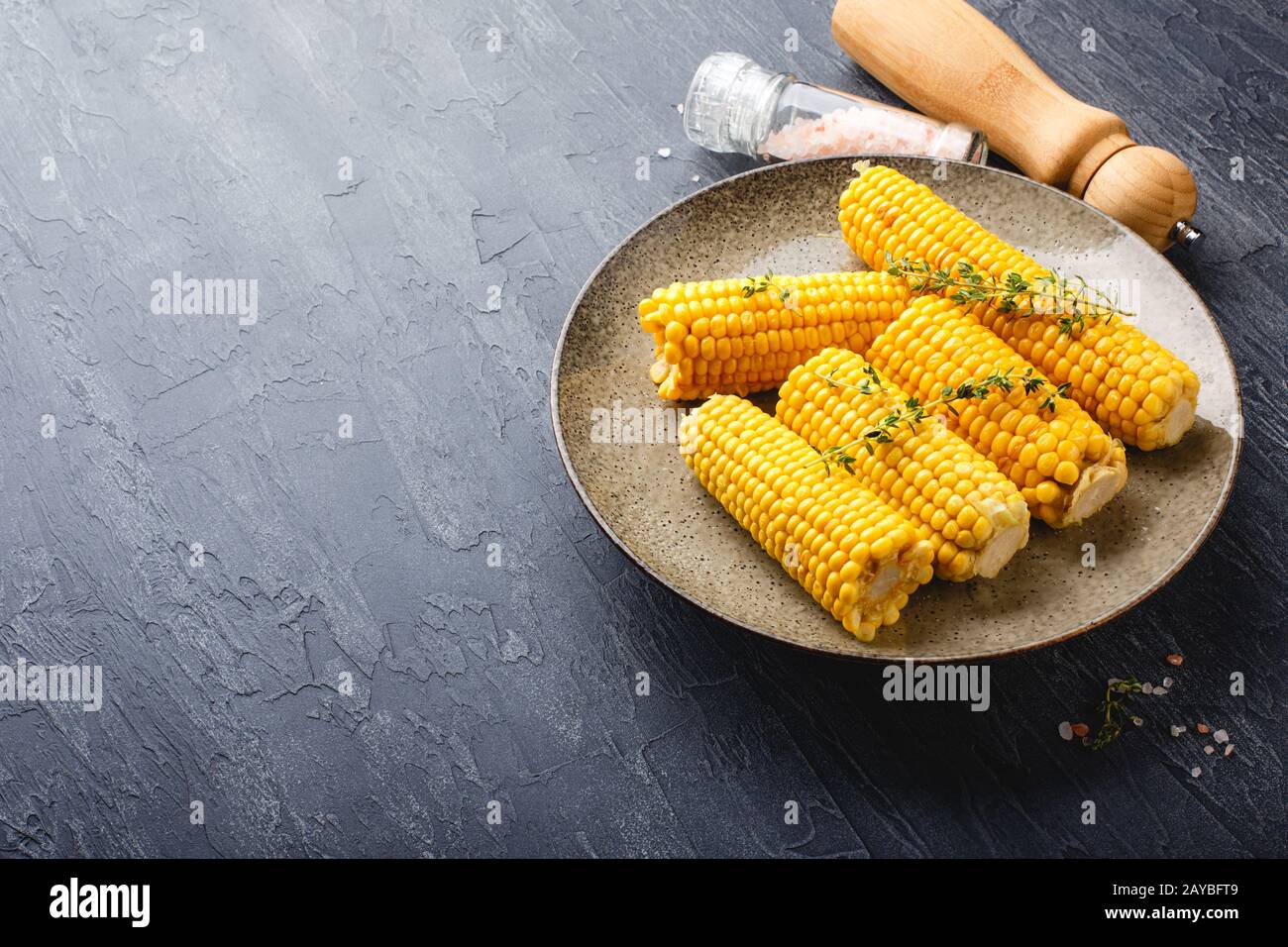 Tasty boiled corn cobs on plate Stock Photo - Alamy