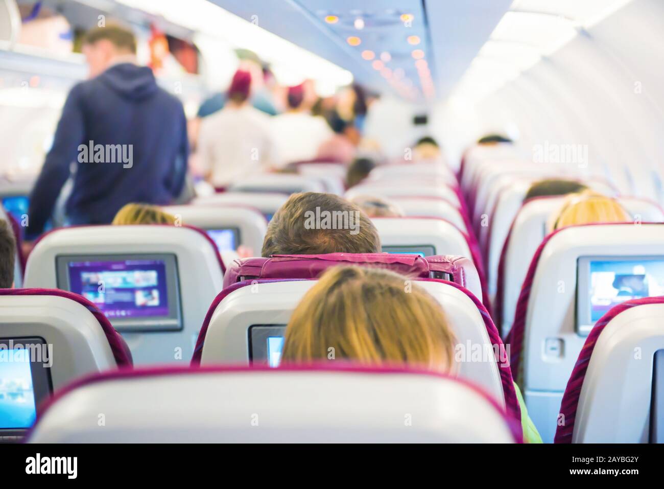 Airplane inside seats woman hi-res stock photography and images - Alamy