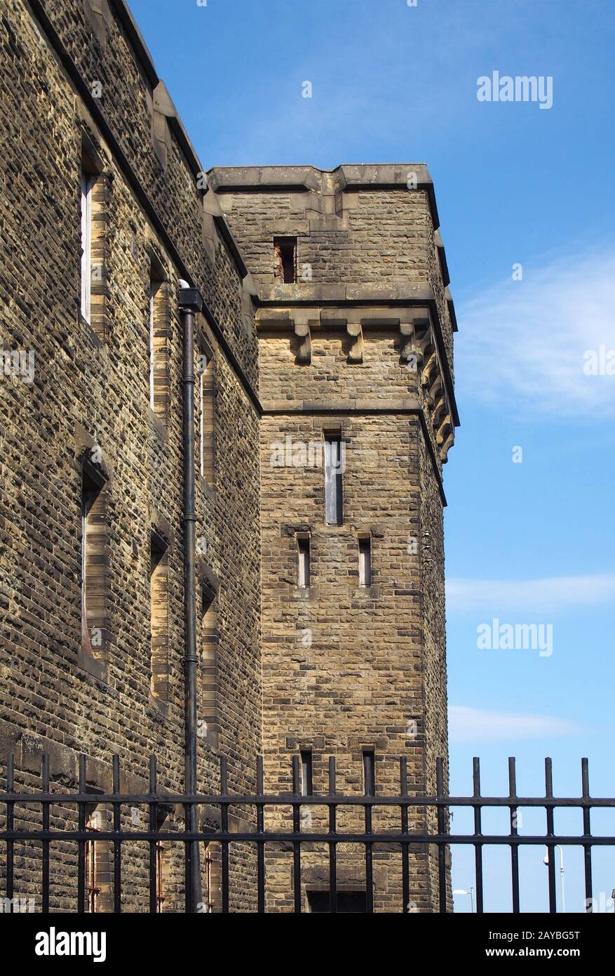 an abandoned victorian british stone institutional building surrounded ...