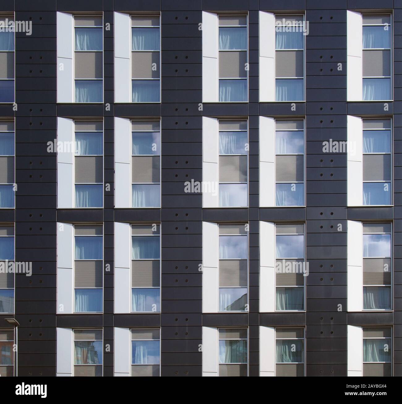 facade of a large black and white modern commercial building with ...