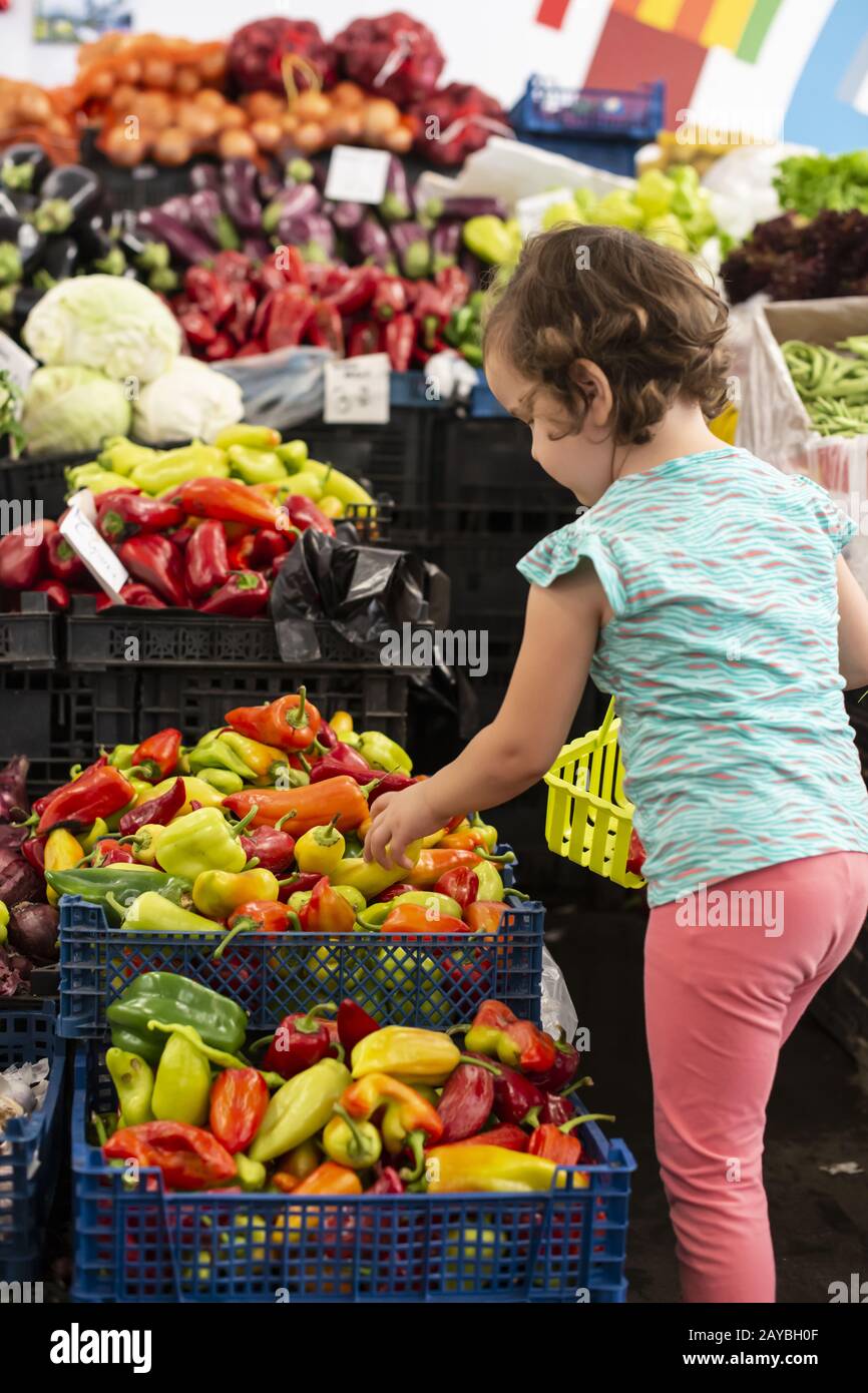 Kid shopping in vegetable market Stock Photo - Alamy