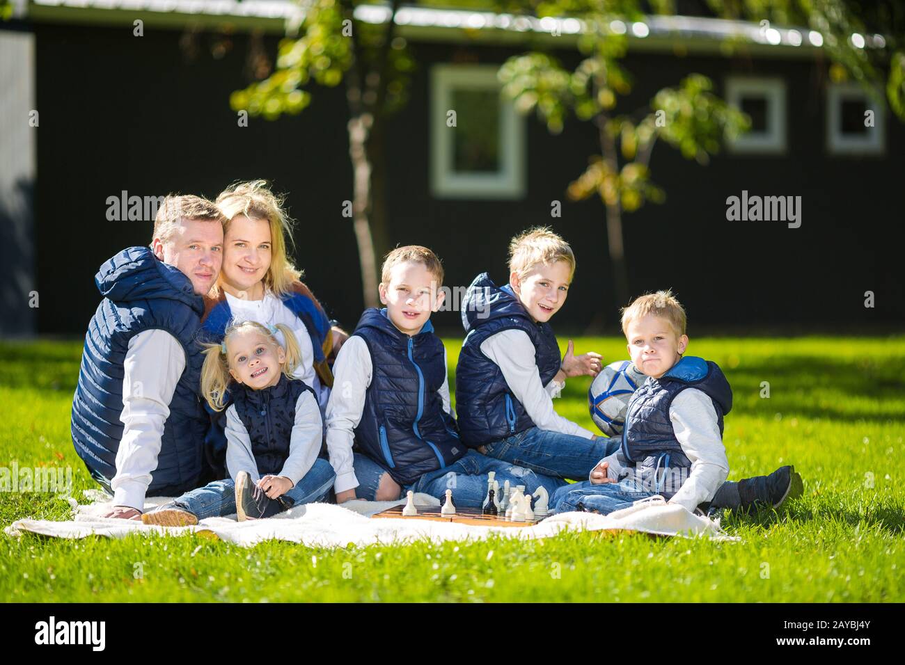 Big Family Relaxing In Green Nature. Happy family portrait on outdoor ...
