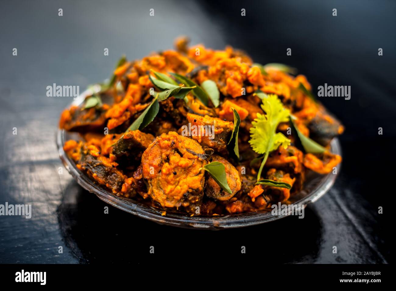 Famous Indian & Gujarati snack dish in a glass plate on wooden surface ...
