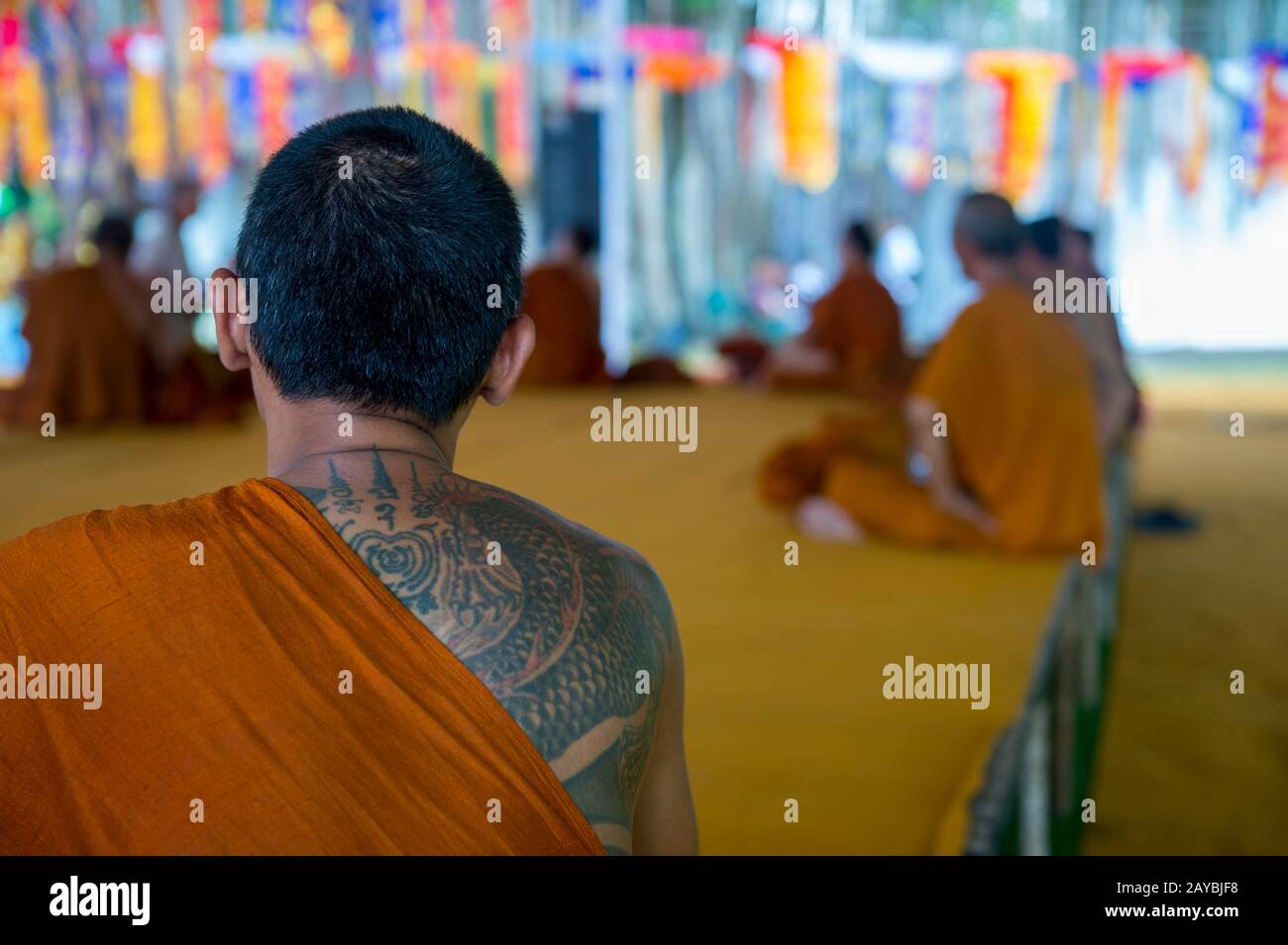 Buddhist monk with tattoos at the Mendut temple (UNESCO World Heritage ...