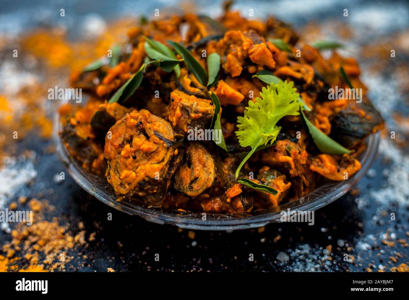 Famous Indian & Gujarati snack dish in a glass plate on wooden surface ...