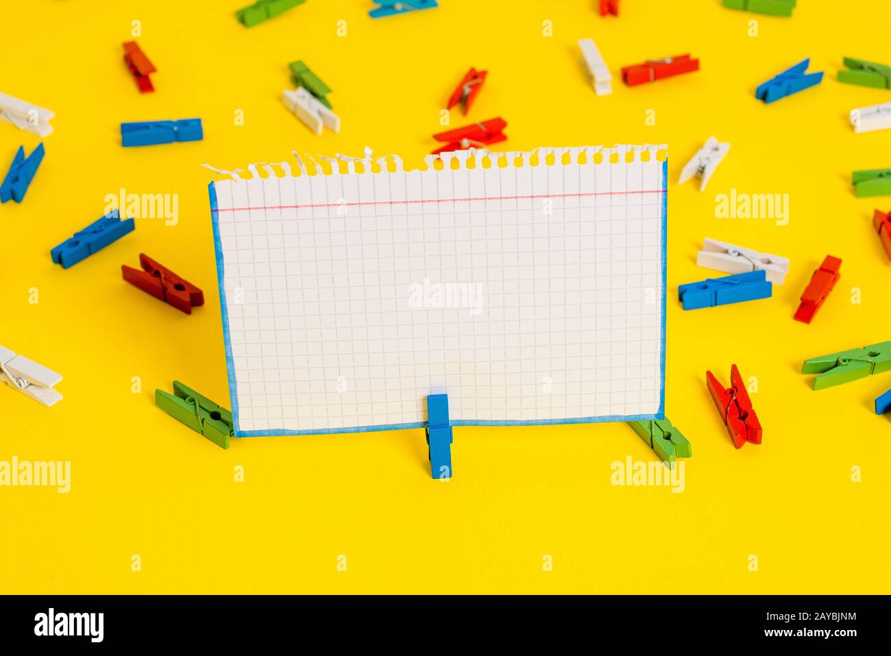 Colored clothespin placed around the empty rectangle square shaped ...