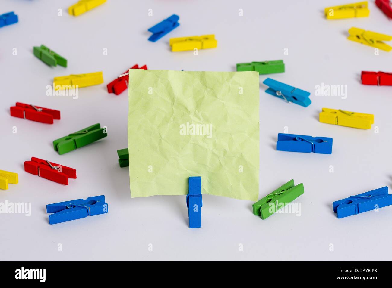 Colored clothespin placed around the empty rectangle square shaped ...