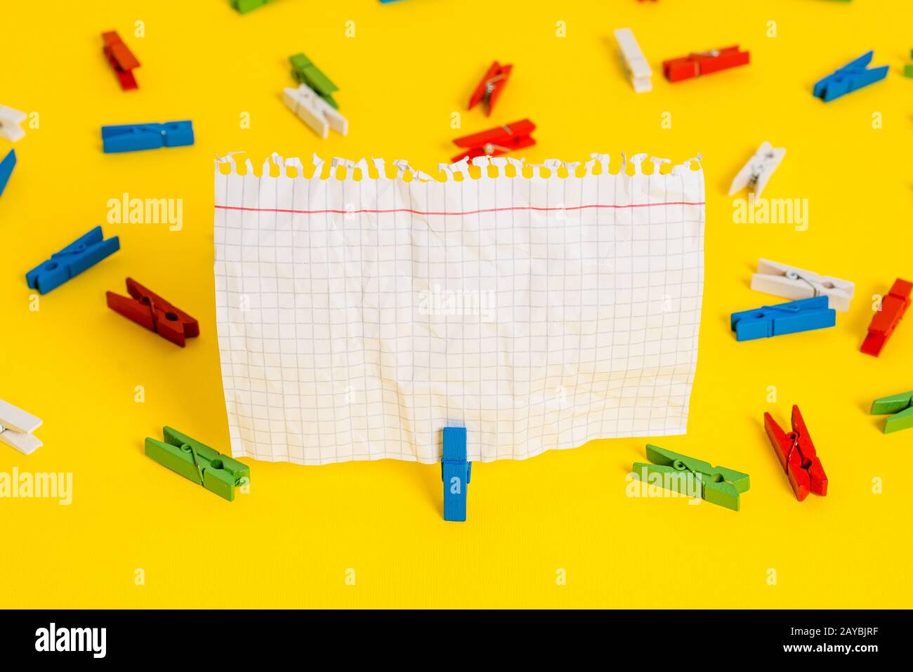 Colored clothespin placed around the empty rectangle square shaped ...