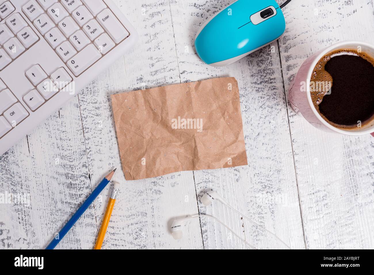 Square rectangle empty paper note above a white wooden floor, computer ...