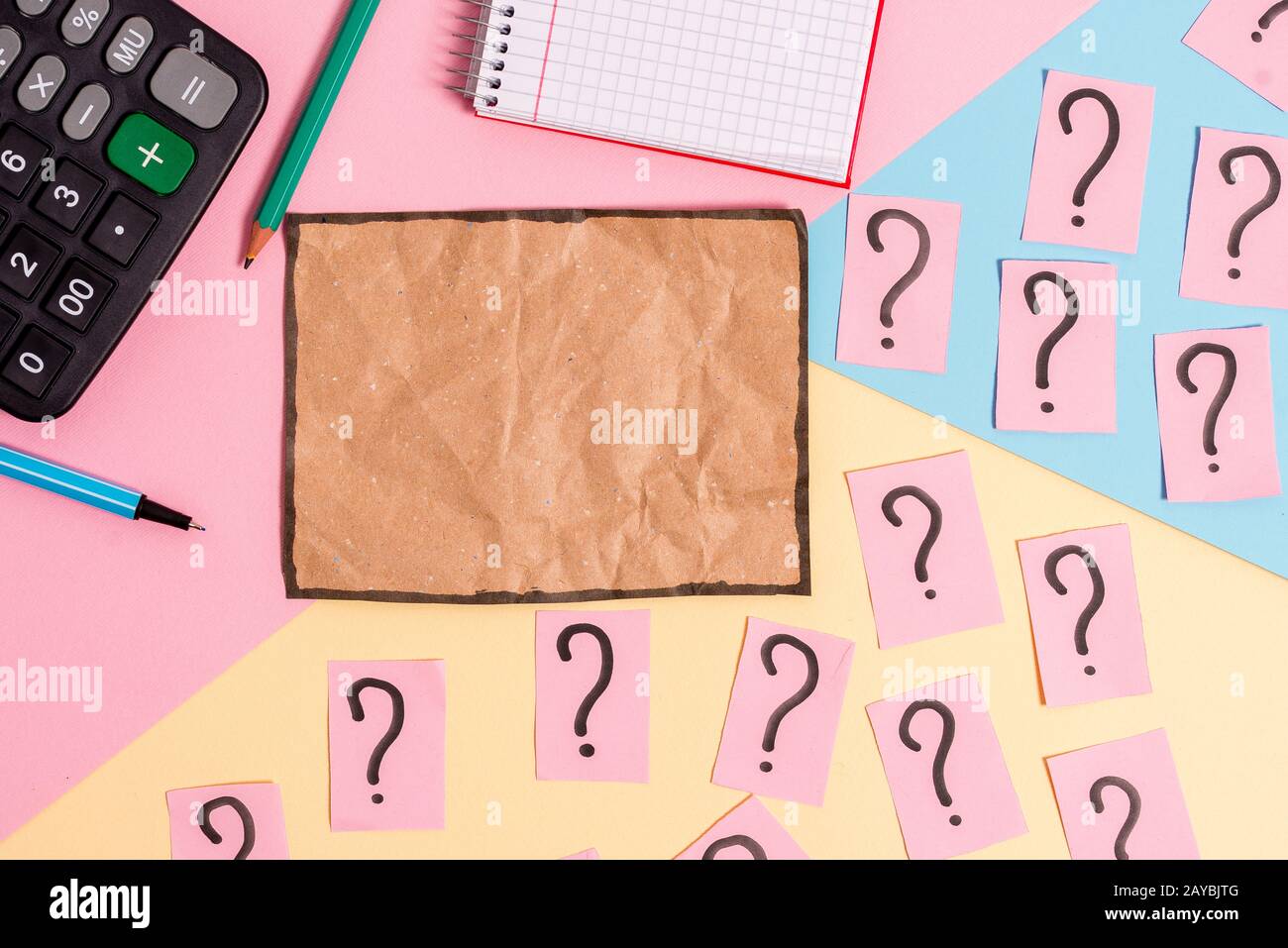 Math stuff with scribbled and crumbling papers plus writing equipment ...