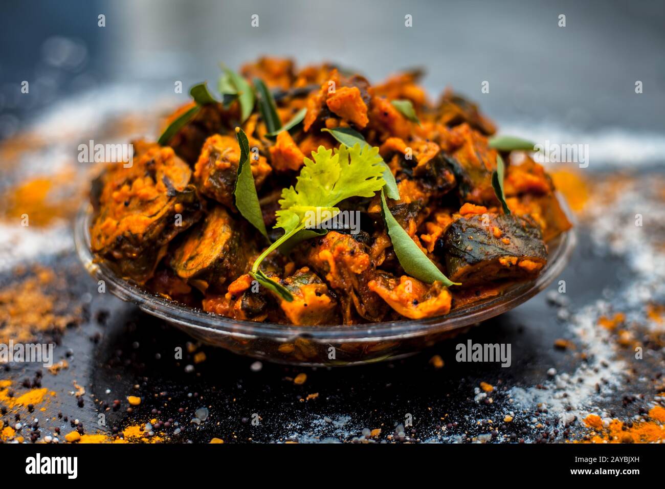 Famous Indian & Gujarati snack dish in a glass plate on wooden surface ...