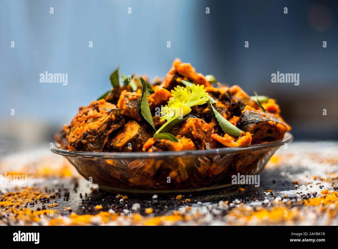 Famous Indian & Gujarati snack dish in a glass plate on wooden surface ...