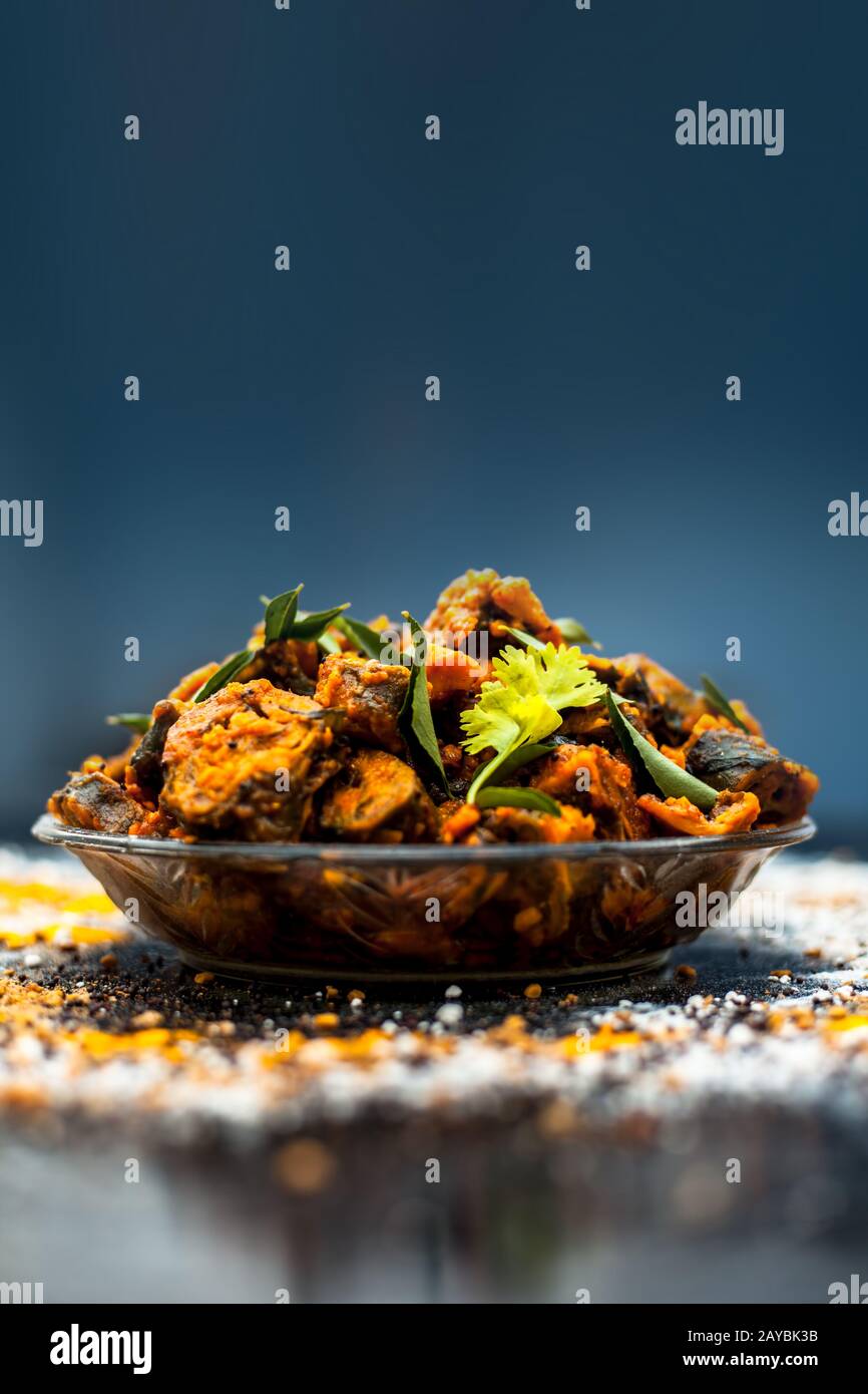 Famous Indian & Gujarati snack dish in a glass plate on wooden surface ...