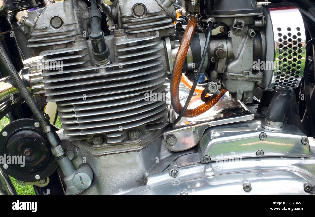 close up side view of a large vintage motorcycle engine with cylinders ...