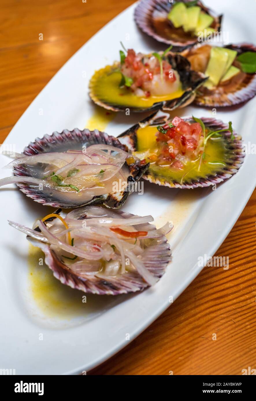 fresh scallops new peruvian cuisine style Stock Photo - Alamy